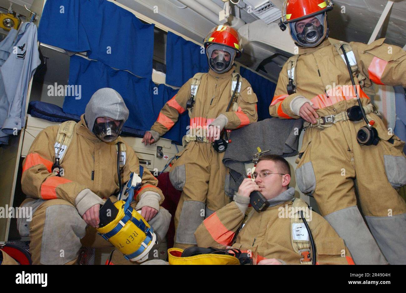 US Navy A firefighting team assigned to Repair Locker Seven Foxtrot ...