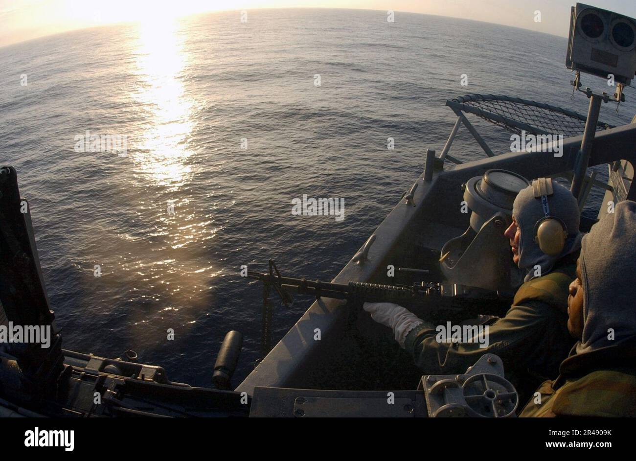 US Navy Ship's crew conduct M-16 machine gun qualifications and ...