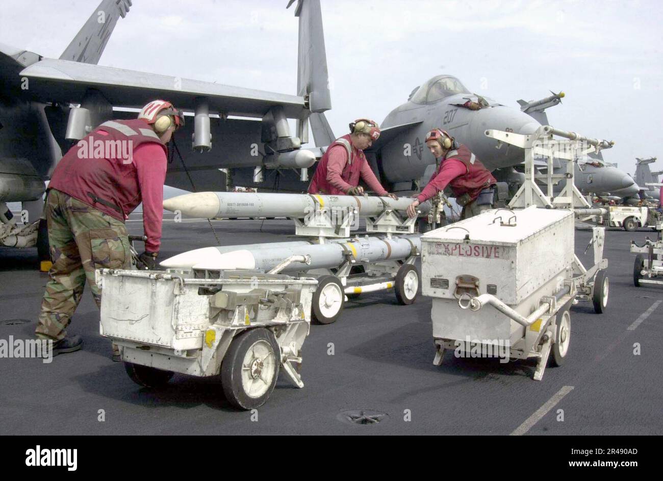 US Navy Aviation Ordnancemen move Advanced Medium Range Air to Air ...