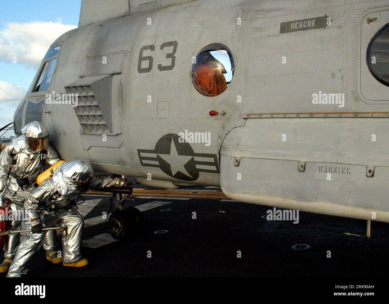 US Navy Sailors assigned to the Crash and Salvage Team aboard Kearsarge ...