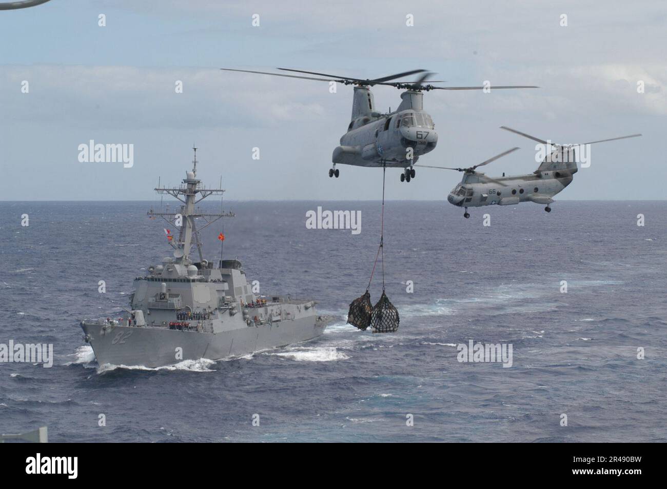 US Navy CH-46D Sea Knights rotate positions during a vertical ...
