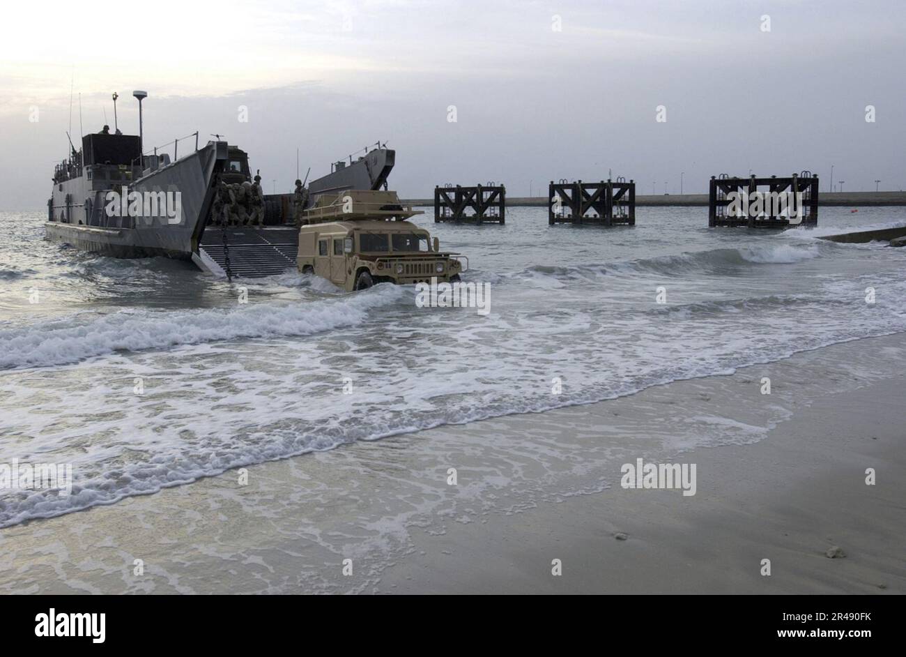 US Navy A High Mobility Multi-purpose Wheeled Vehicle (HMMWV) roles off ...
