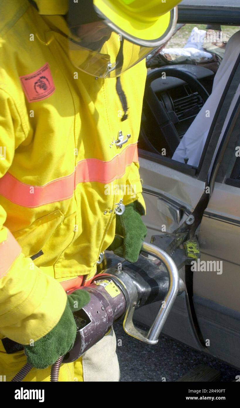 US Navy A firefighter uses the ''Jaws of Life'' Stock Photo - Alamy