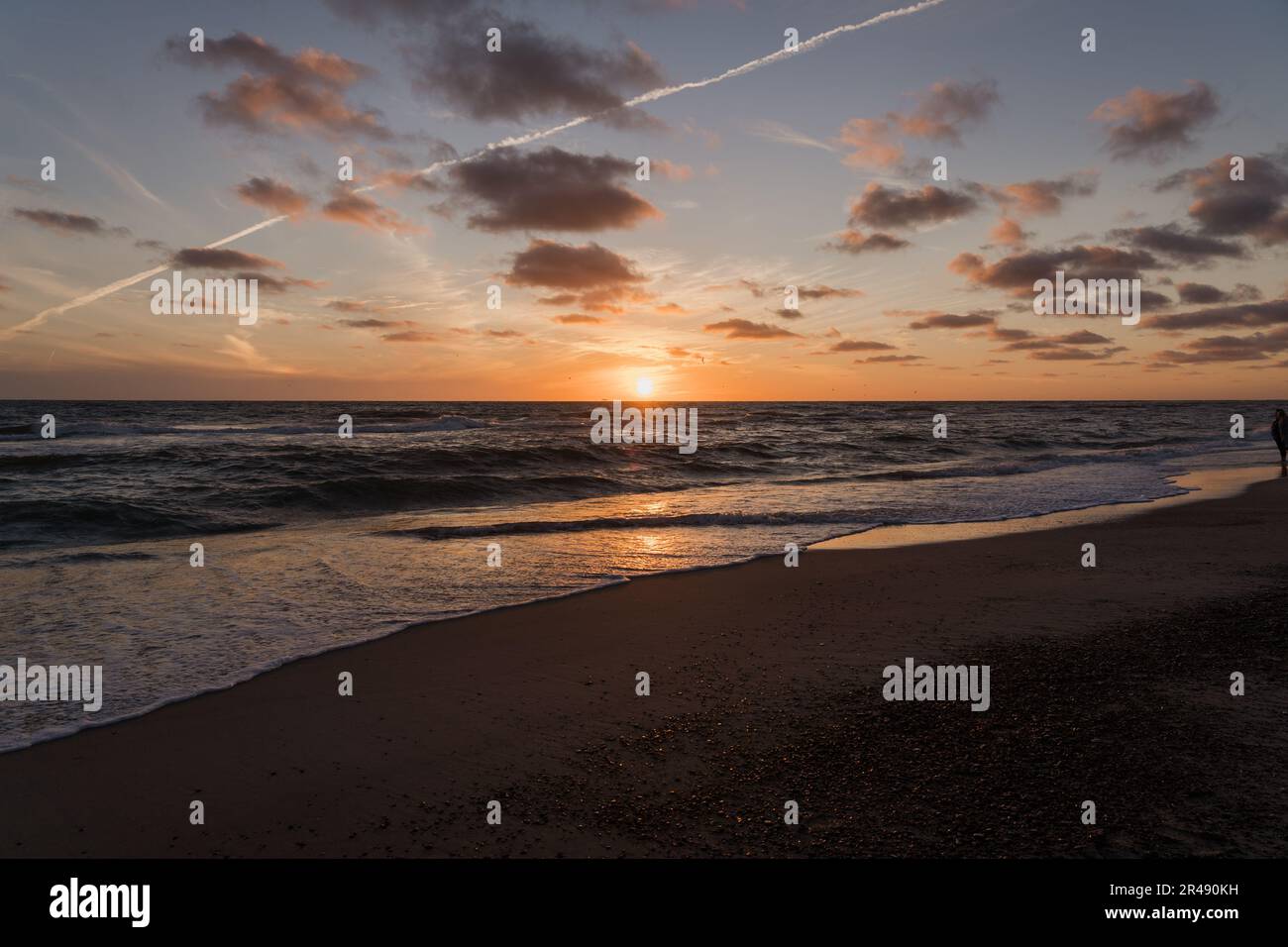 An aerial view of sea waves washing beach during susnet Stock Photo - Alamy