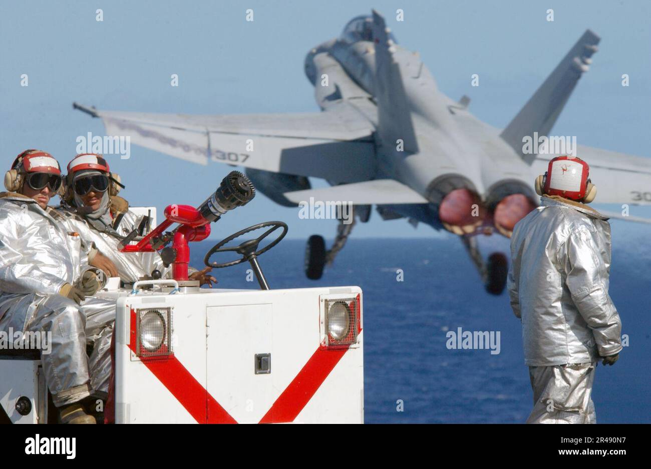 Us Navy Crash And Salvage Crew Members Standby On The Bow Of Uss Carl Vinson Cvn 70 In Case Of