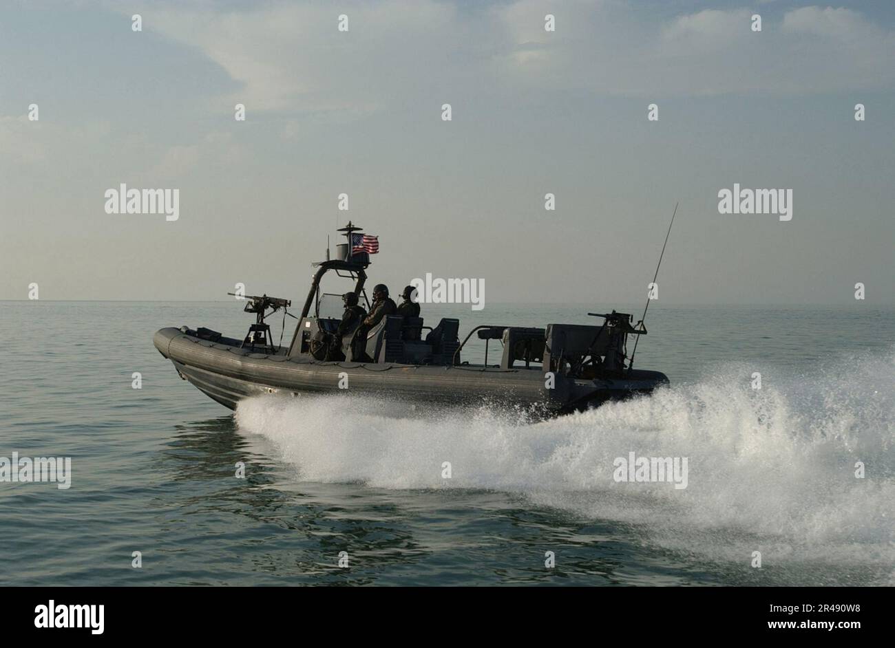 US Navy Naval Special Warfare combatant-craft crewmen operate a Rigid ...