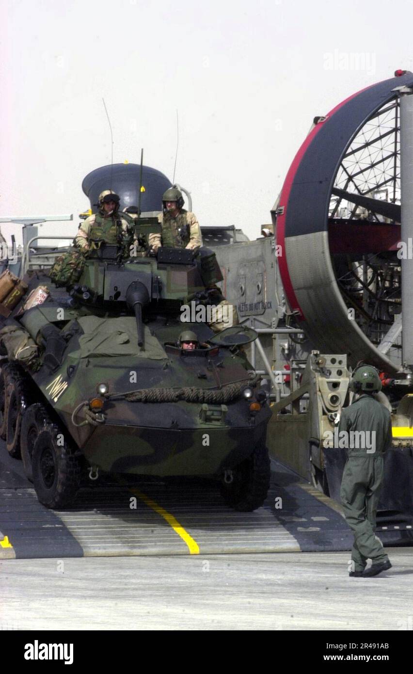 US Navy A member of Assault Craft Unit Five (ACU-5) directs a U.S ...