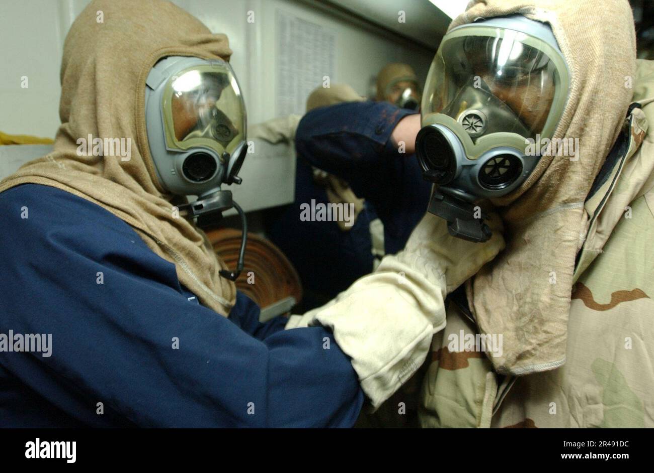 US Navy Crewmembers aboard the guided missile cruiser USS Anzio (CG 68 ...