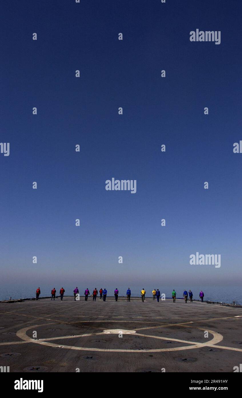 US Navy flight deck crew aboard the amphibious dock landing ship USS ...