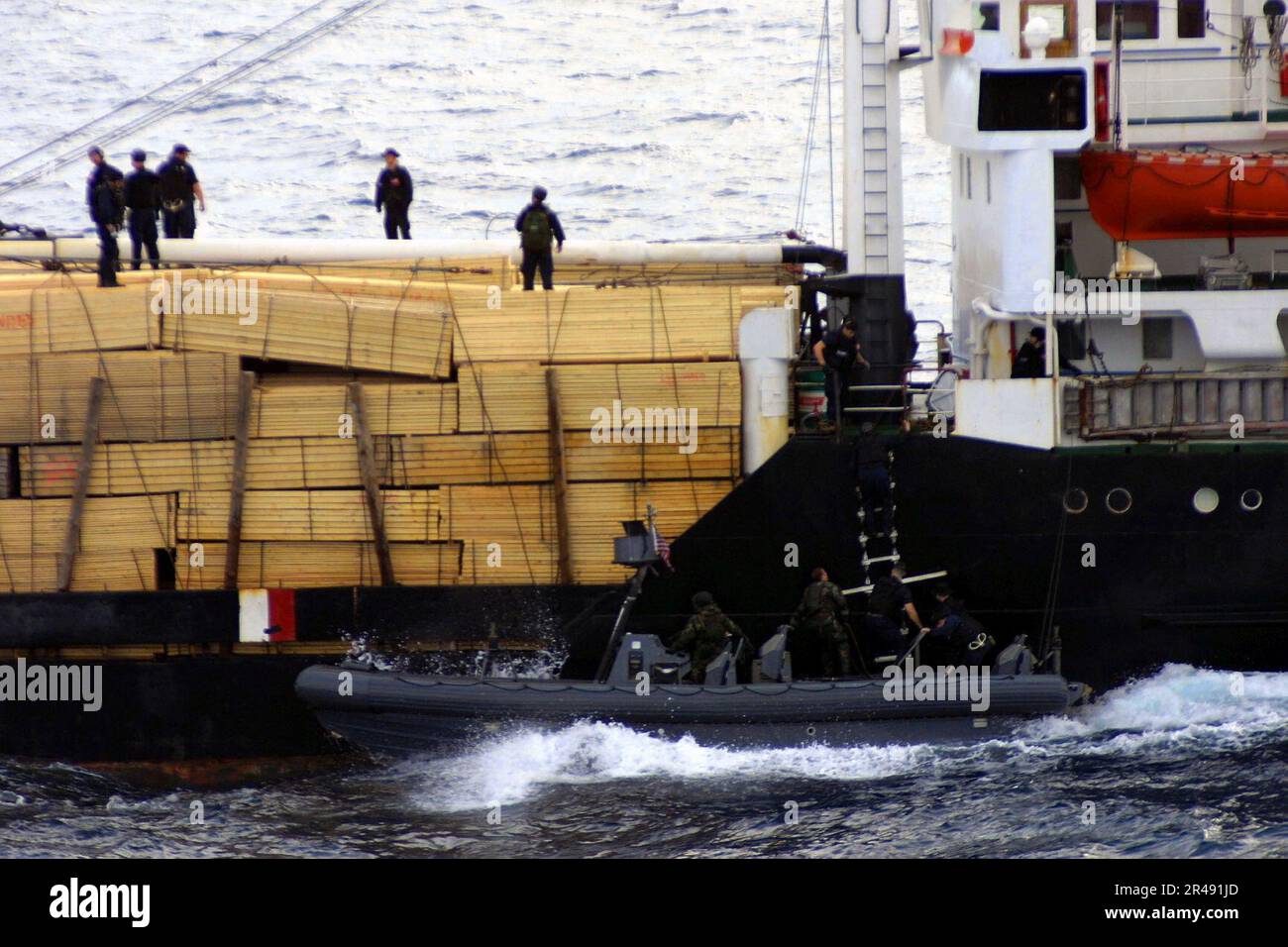 US Navy Members of the Visit, Board, Search and Seizure (VBSS) team ...