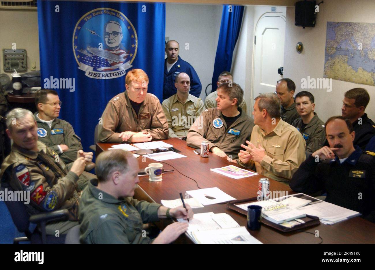 US Navy Staff officers brief the Admiral on the current battle ...