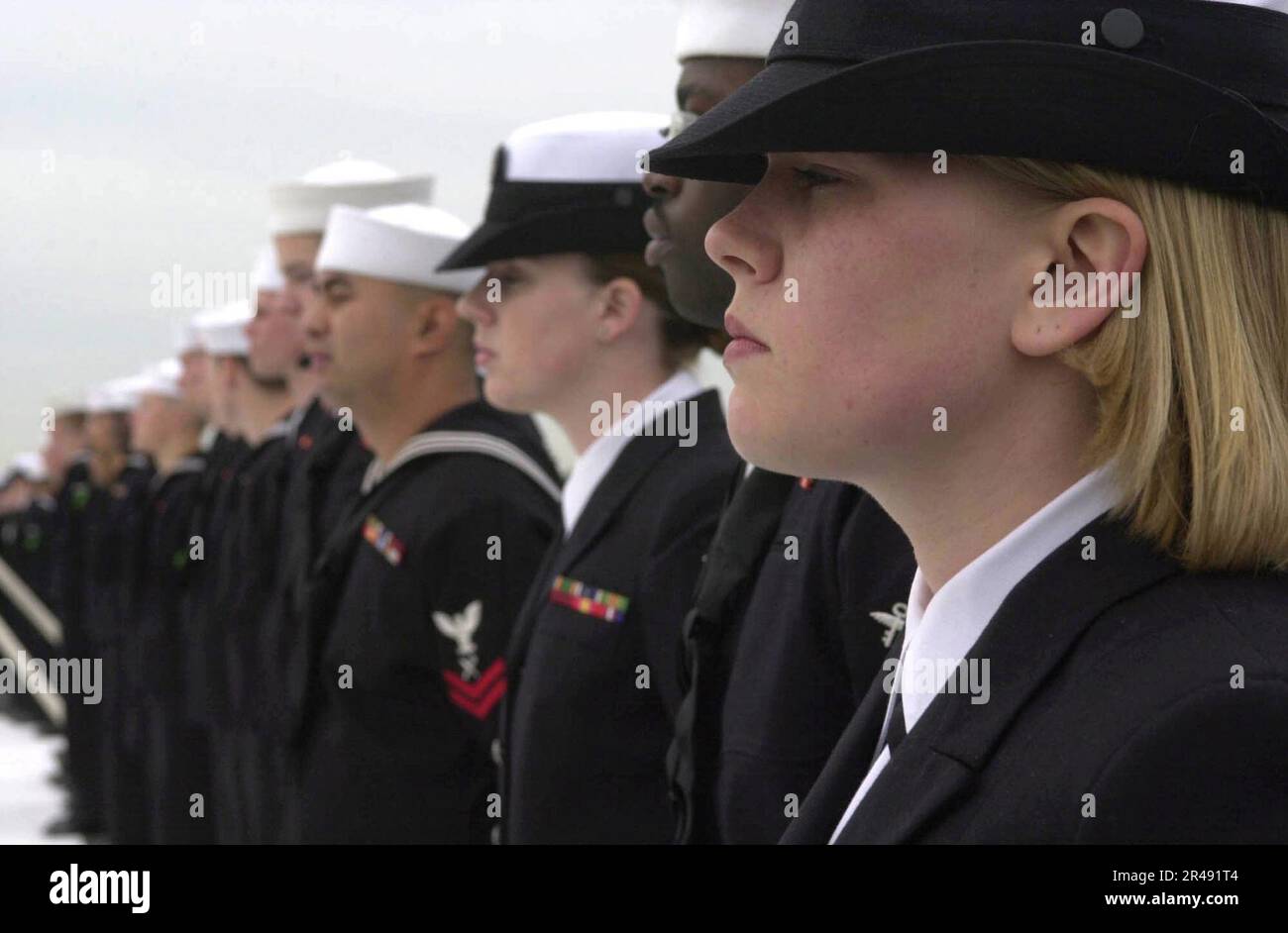US Navy Sailors man the rail aboard USS Nimitz while they depart for ...