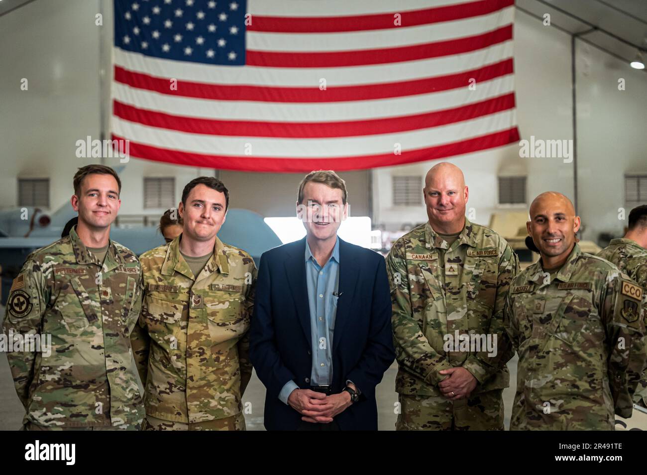 U.S. Sen. Michael Bennet of Colorado poses with U.S. Air Force Airmen ...