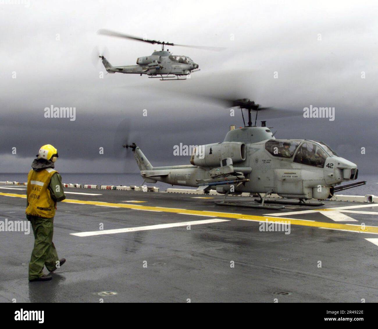 US Navy An AH-1W Cobra helicopter waits to take off from the flight ...