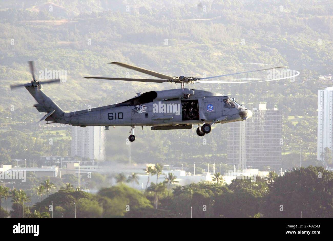 US Navy SH-60 Seahawk stands plane guard for the aircraft carrier USS ...