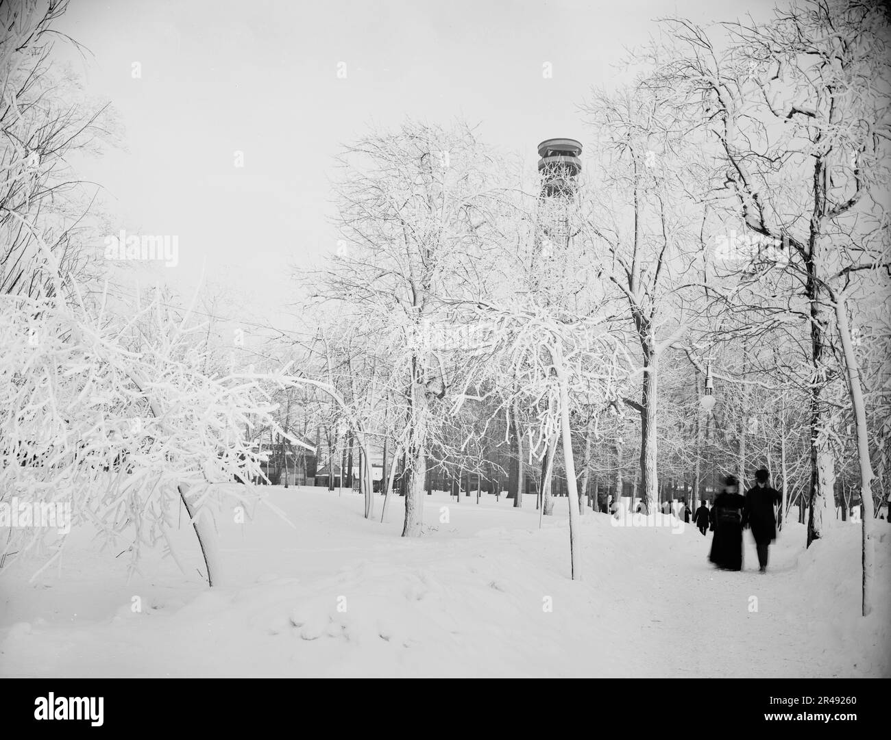 Woman walking park winter Black and White Stock Photos & Images - Alamy