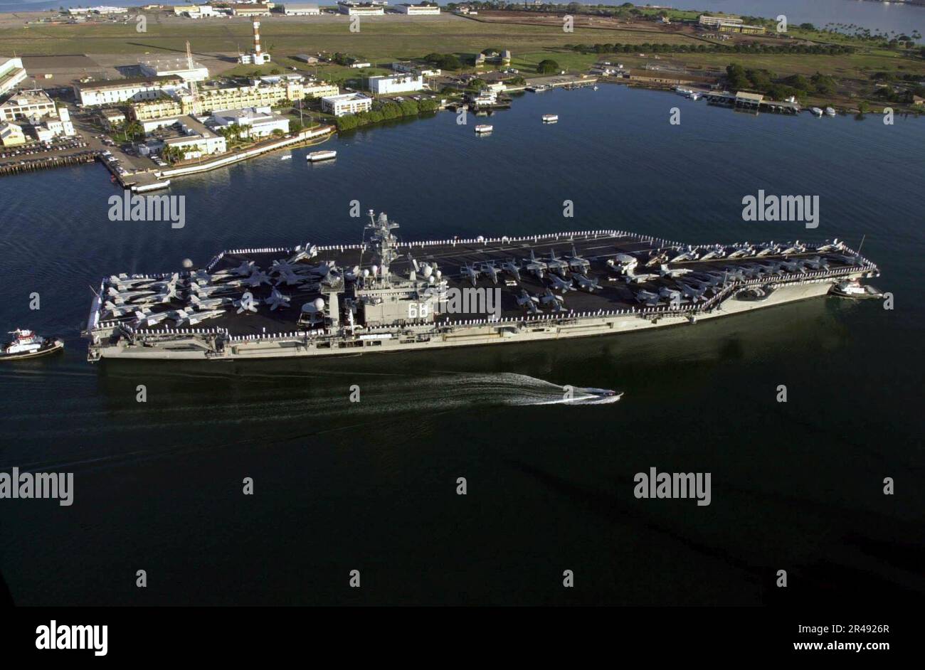 US Navy Crewmembers aboard the aircraft carrier USS Nimitz (CVN 68) man ...