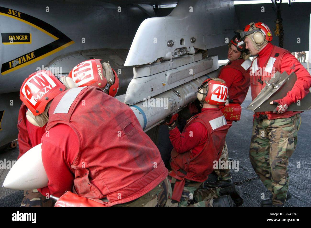 US Navy Ordnancemen mount a training version of the RIM-7 Stock Photo ...