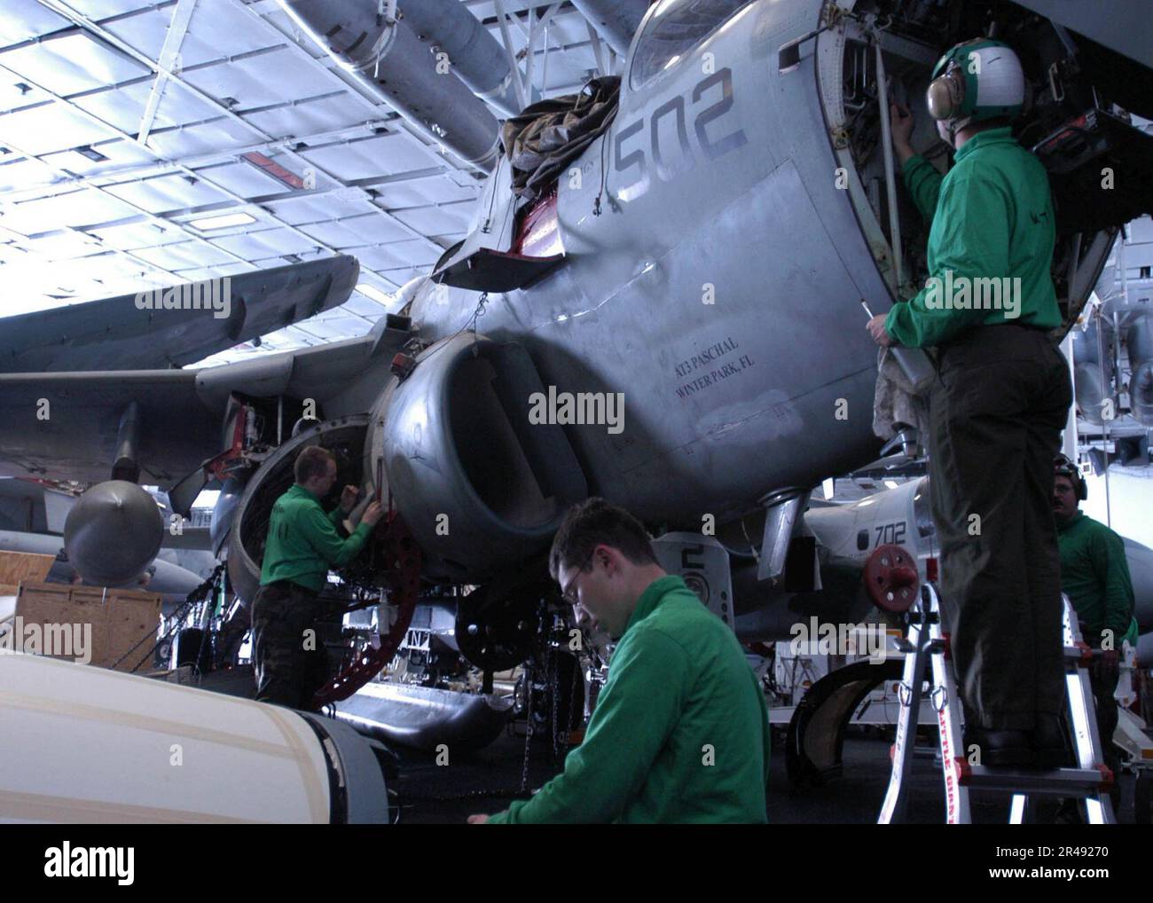 US Navy Crewmembers work on a EA-6B Prowler aboard USS Theodore ...