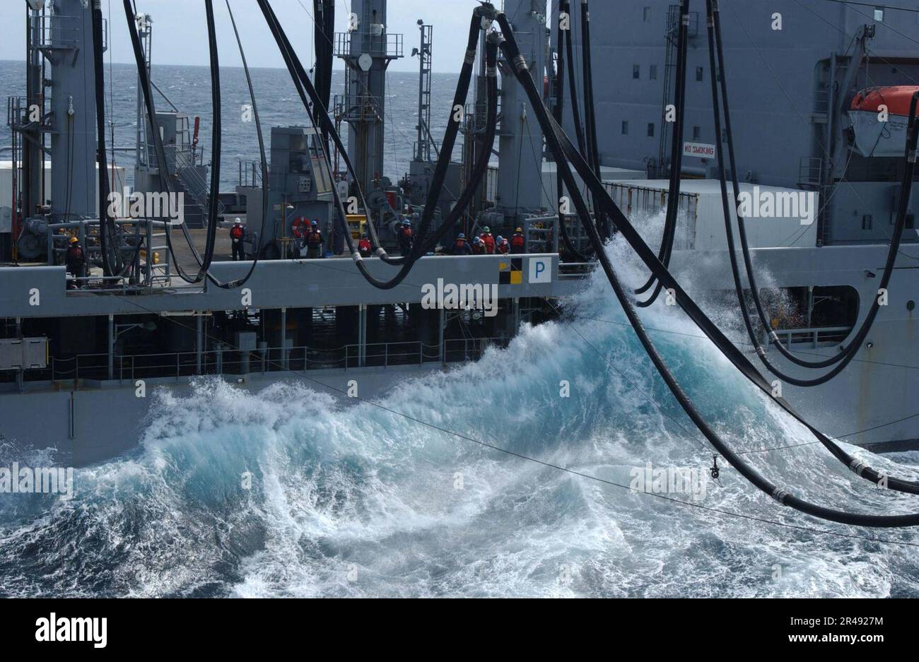 US Navy Waves reach the main decks of the fleet oiler USNS Rappahannock ...