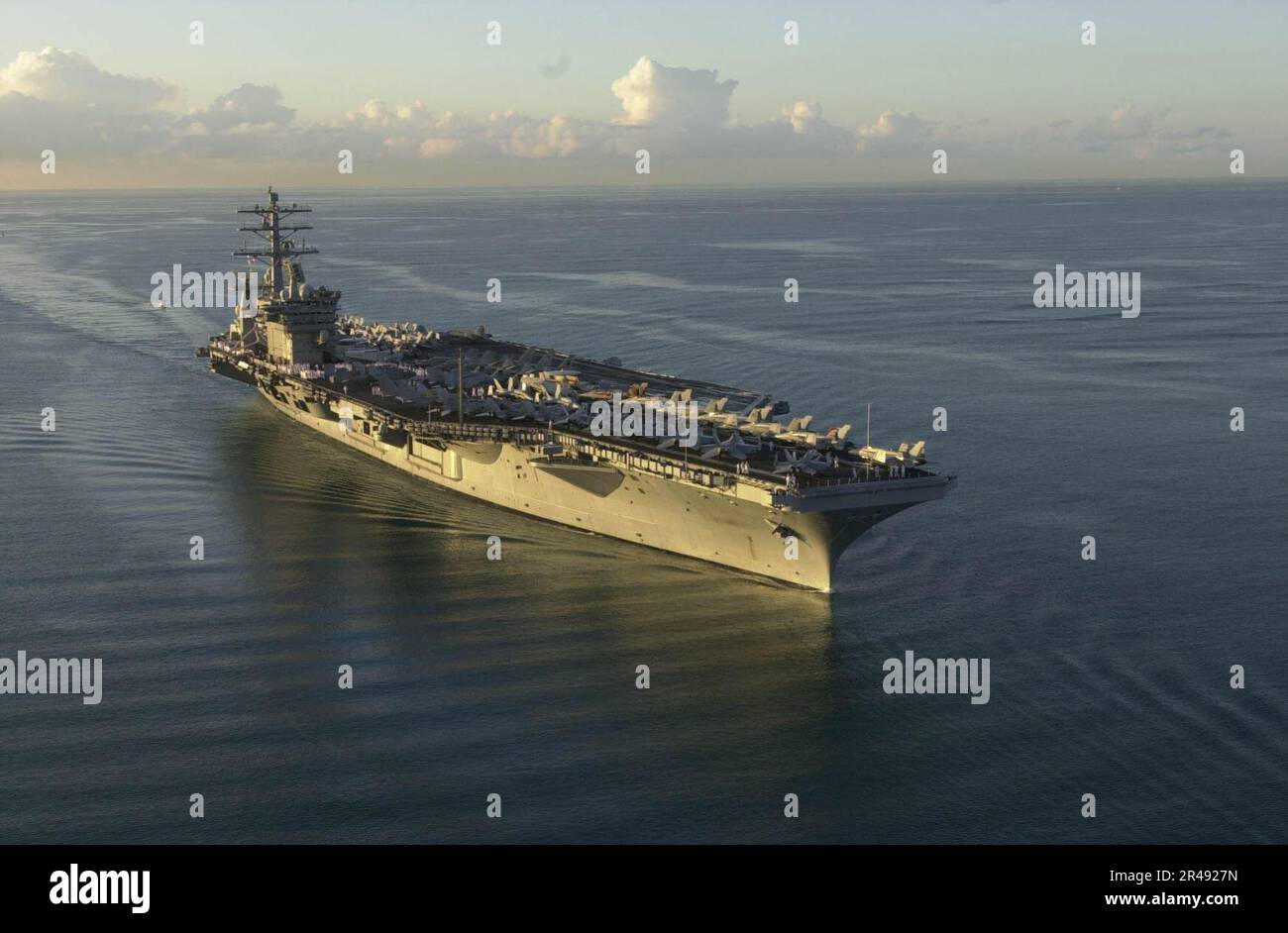 US Navy Crewmembers aboard the aircraft carrier USS Nimitz (CVN 68) man ...