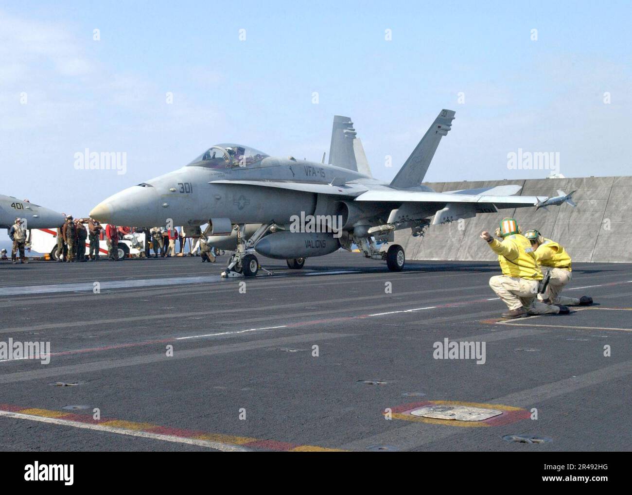 US Navy shooters give the signal for launch to an F-A-18 Hornet Stock ...