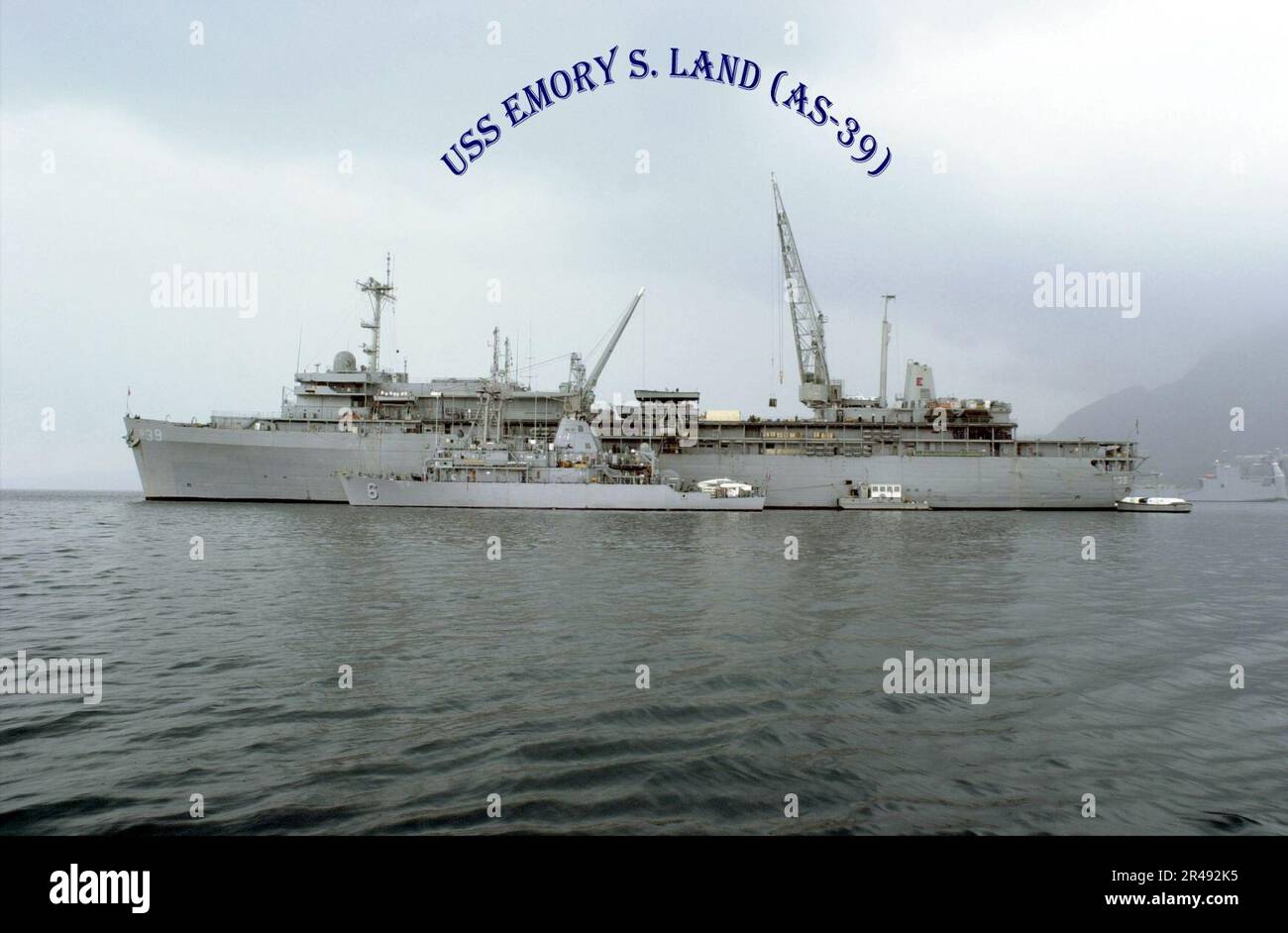 US Navy The submarine tender USS Emory S. Land (AS 39) sits at anchor in Souda Bay with two ...