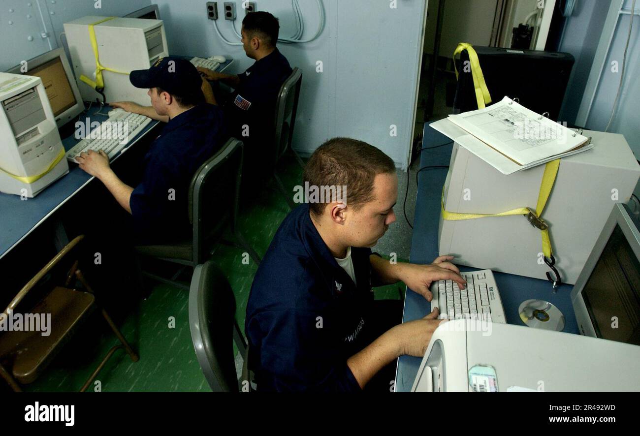 US Navy Sailors aboard USS Shiloh (CG 67) keep in touch with their ...