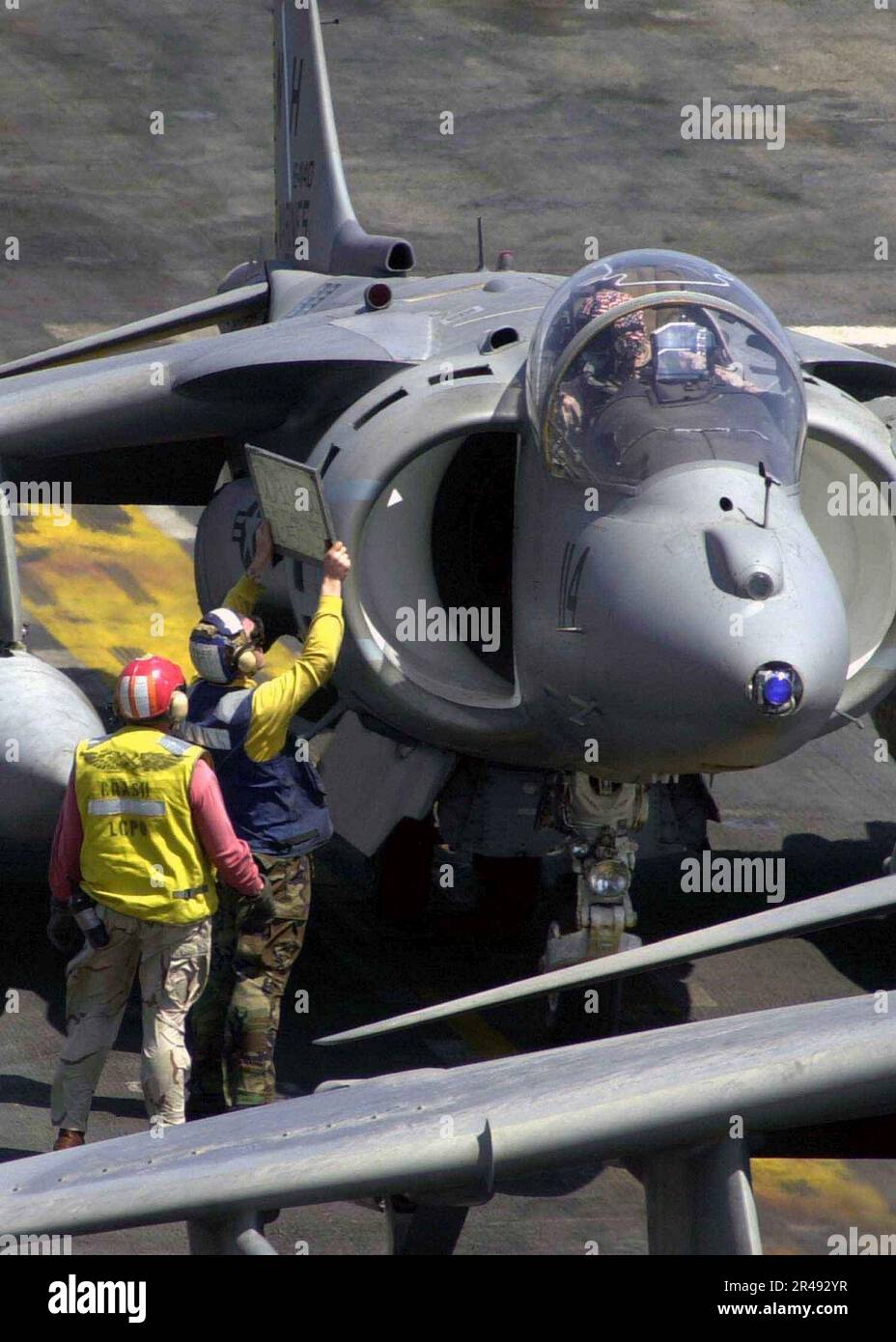 US Navy An AV-8 Harrier pilot gets a fuels update before taking off ...