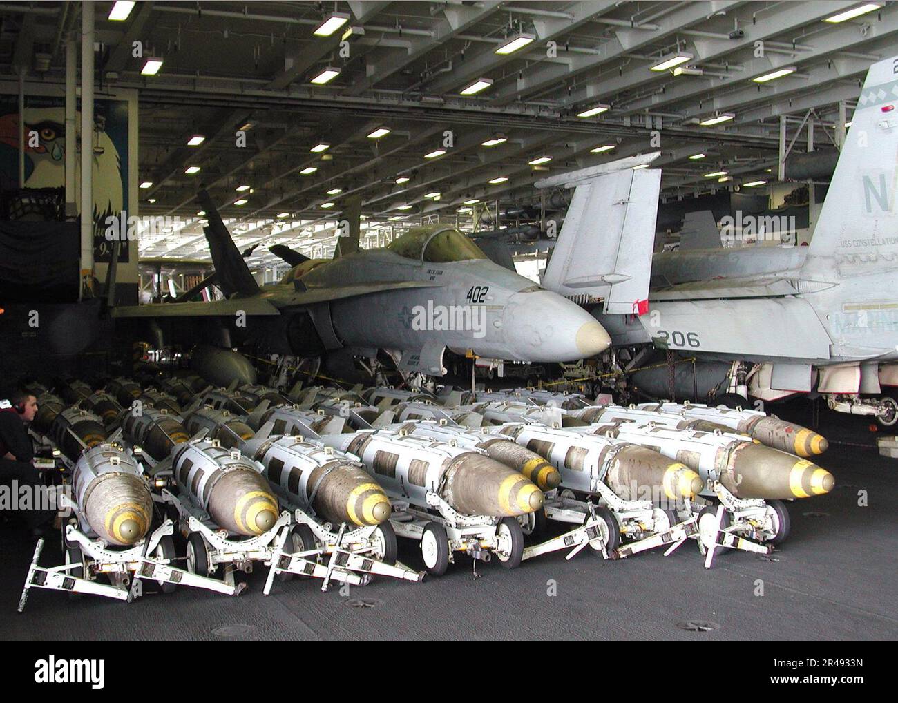 US Navy Dozens of bombs line the hangar bay aboard USS Constellation ...