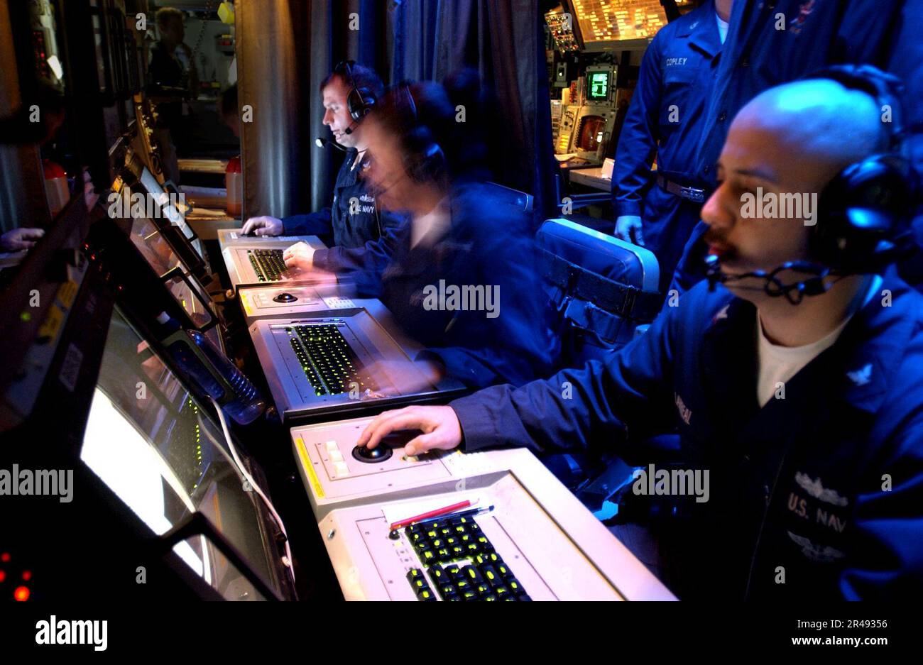 US Navy Sailors assigned to the Tomahawk Strike Team aboard USS Shiloh ...