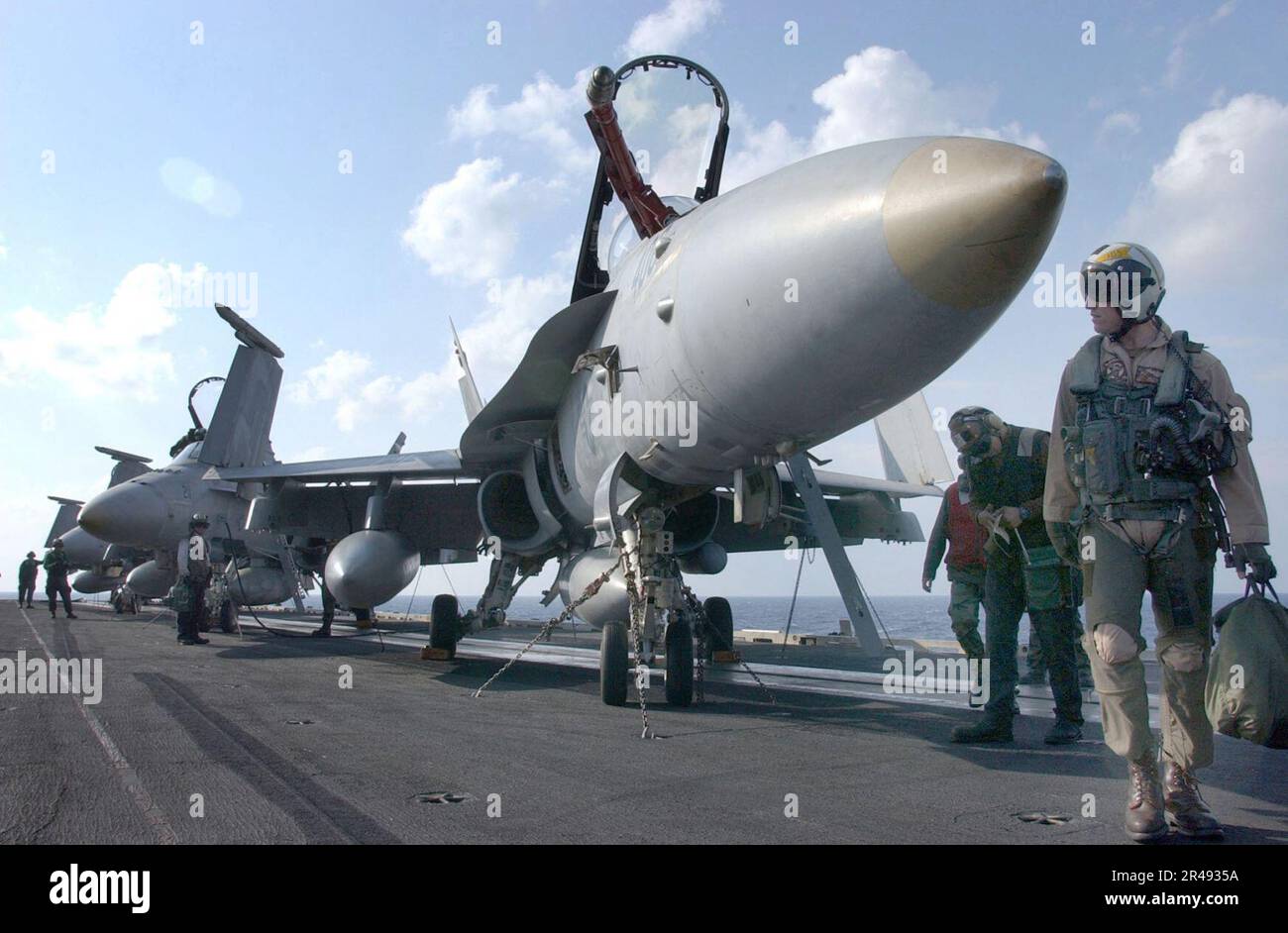 US Navy An F-A-18 Hornet pilot performs a routine maintenance check ...