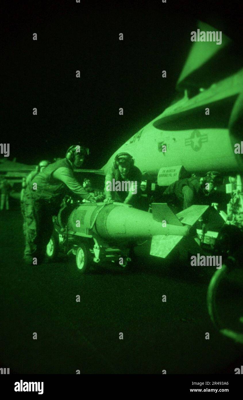 US Navy Aviation Ordnancemen load GBU-31 Joint Direct Attack Munitions ...