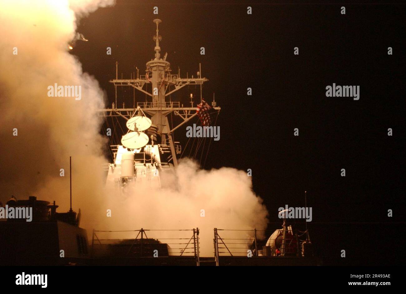 US Navy Tomahawk Land Attack Missiles (TLAM) launch from the ship's ...