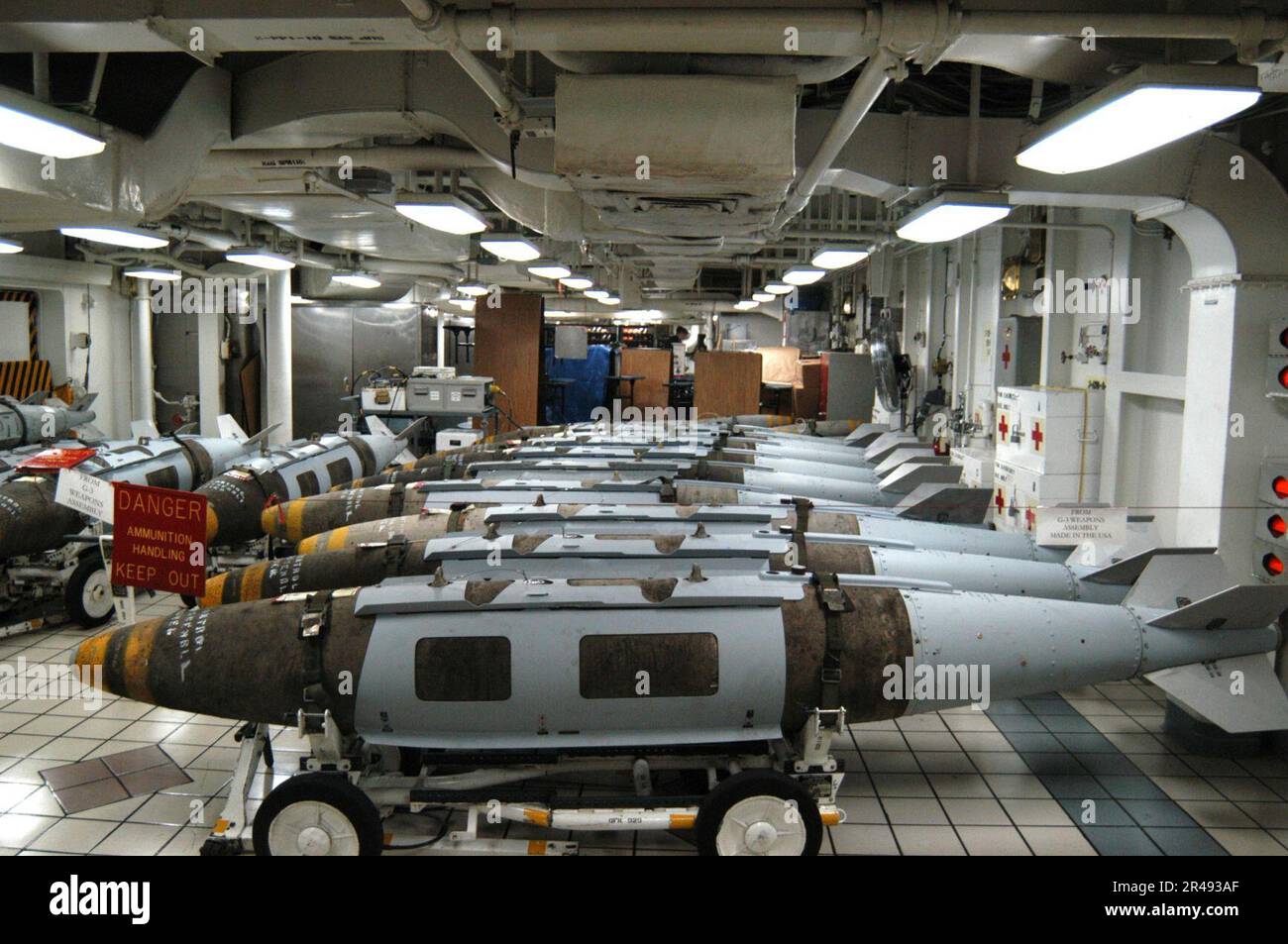 US Navy Joint Direct Attack Munitions (JDAM) sit on the mess decks in ...