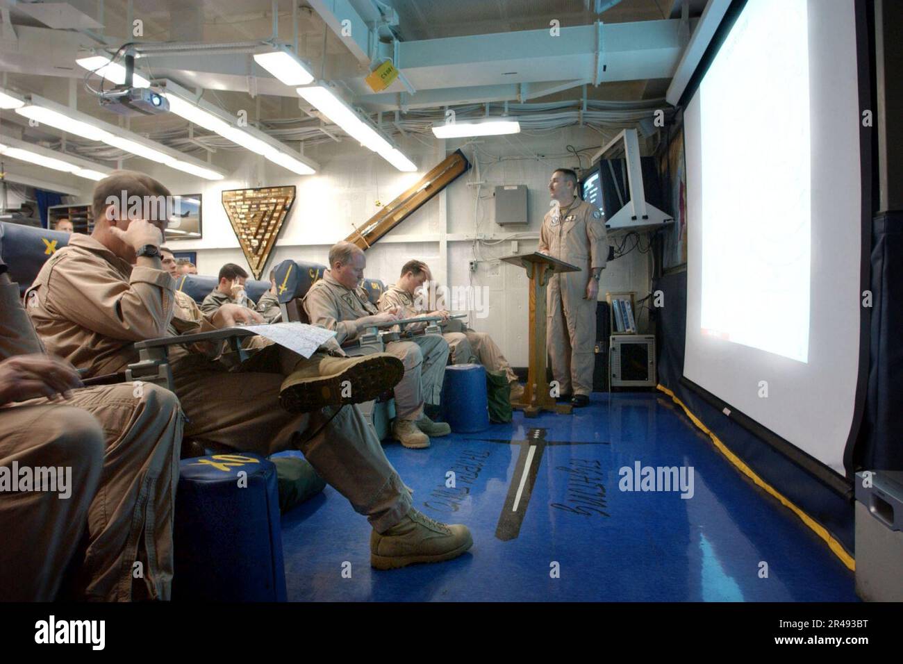 US Navy A U.S. Marine aviator briefs pilots of Carrier Air Wing Three ...