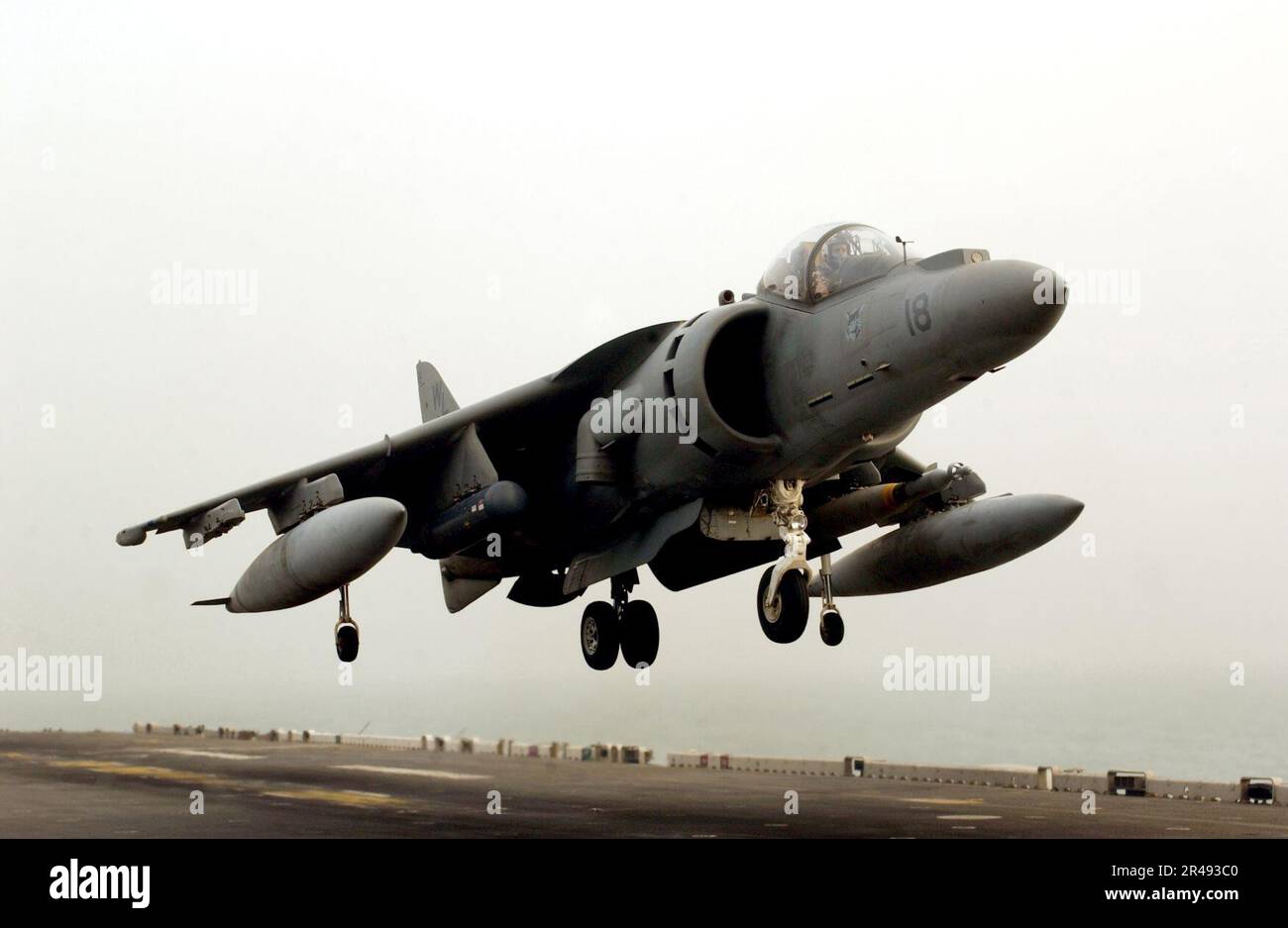 US Navy A Marine AV-8B Harrier makes a vertical landing aboard the ...