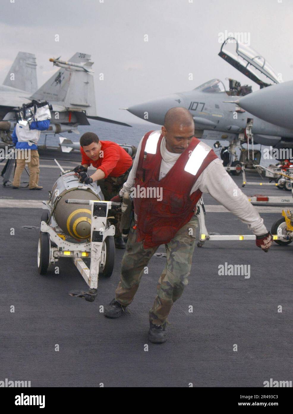 US Navy Aviation Ordnancemen assigned to 'The Swordsmen' of Fighter ...