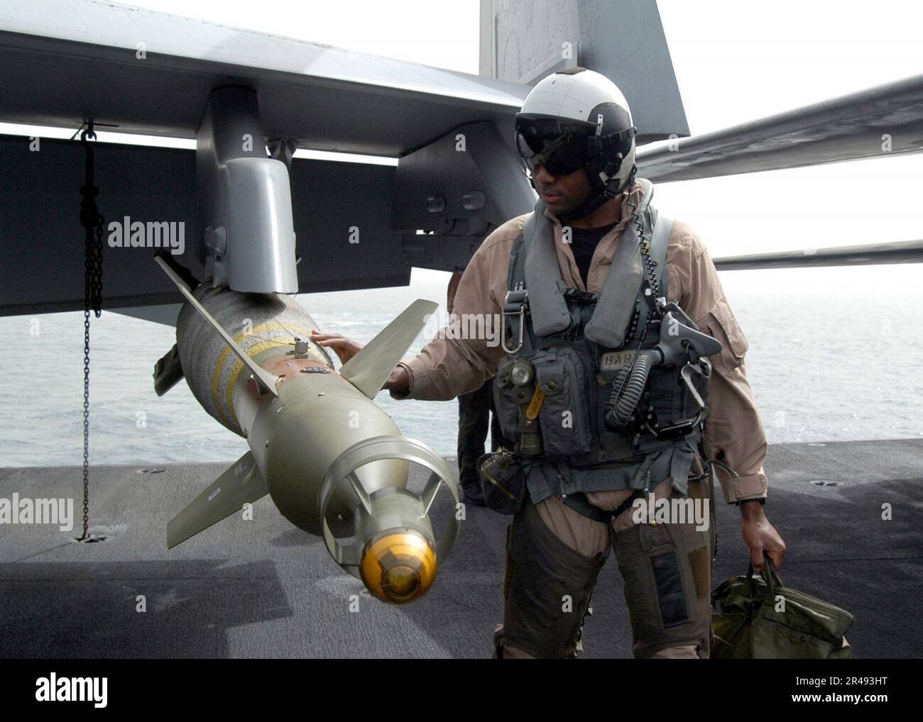 US Navy A Naval Aviator conducts a preflight inspection of precision ...