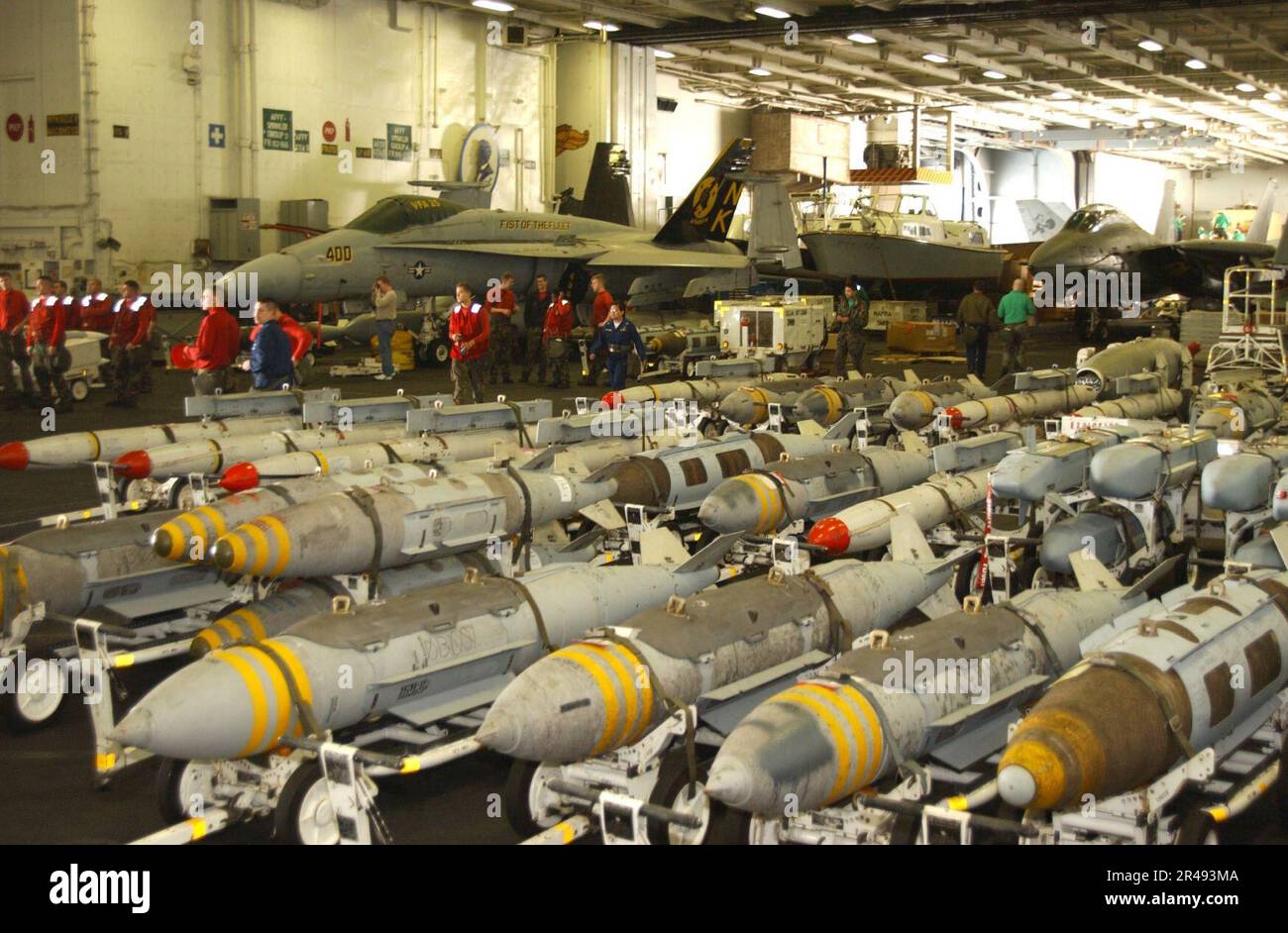 US Navy Skids of 2,000-pound precision guided ordnance wait in the Ship ...