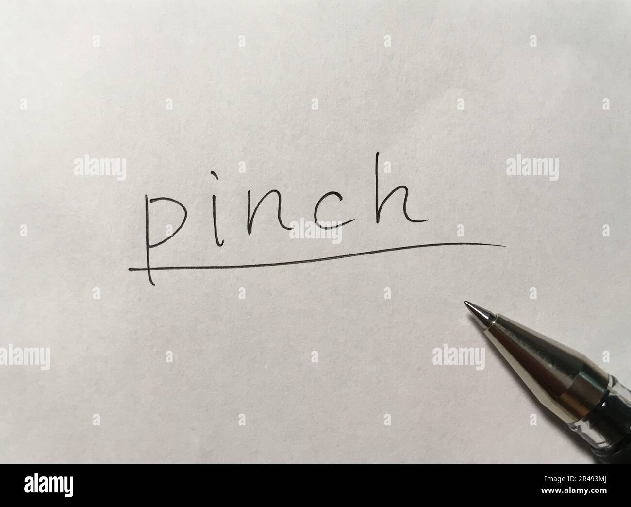 Pinch concept word on paper background Stock Photo - Alamy