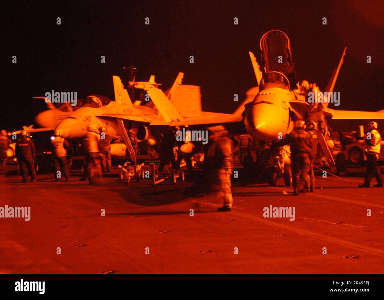 US Navy Carrier Air Wing Eight (CVW-8) aircraft await weapons and make ...