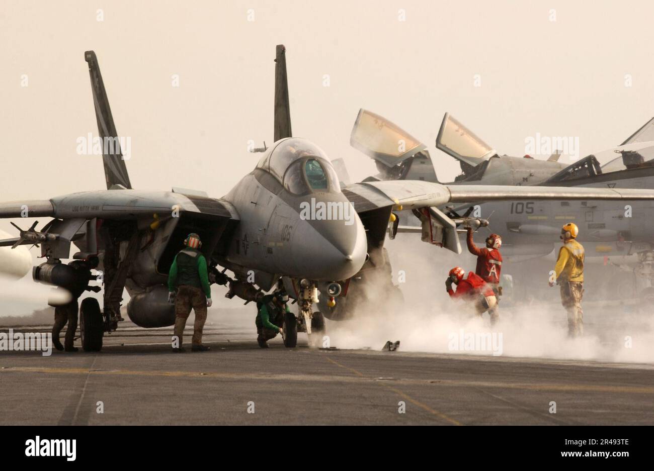 US Navy Flight deck personnel launch from the flight deck of the ...