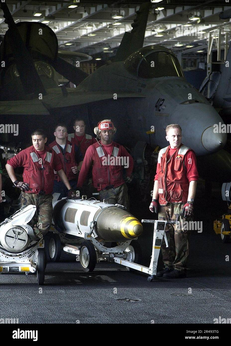 US Navy Ordnance handlers await moving orders while relocating ordnance ...