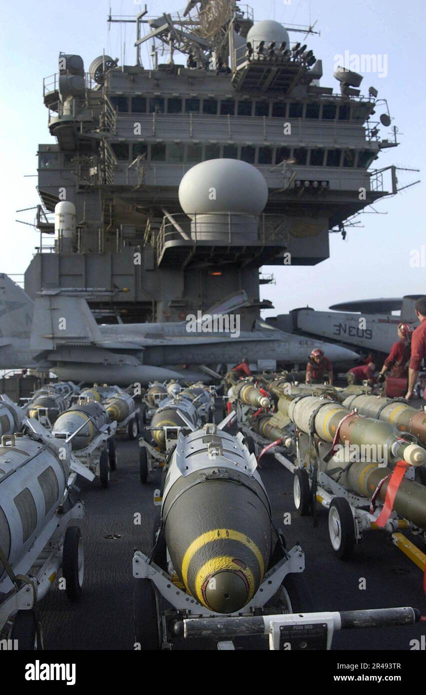 US Navy Assorted bombs are raised to the flight deck on elevators ...