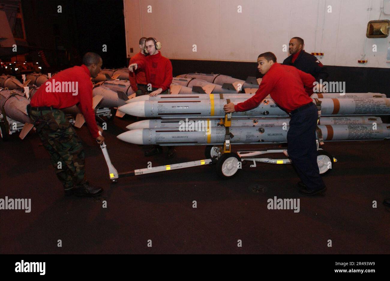 US Navy Aviation Ordnancemen assigned to weapons department, transfer ...