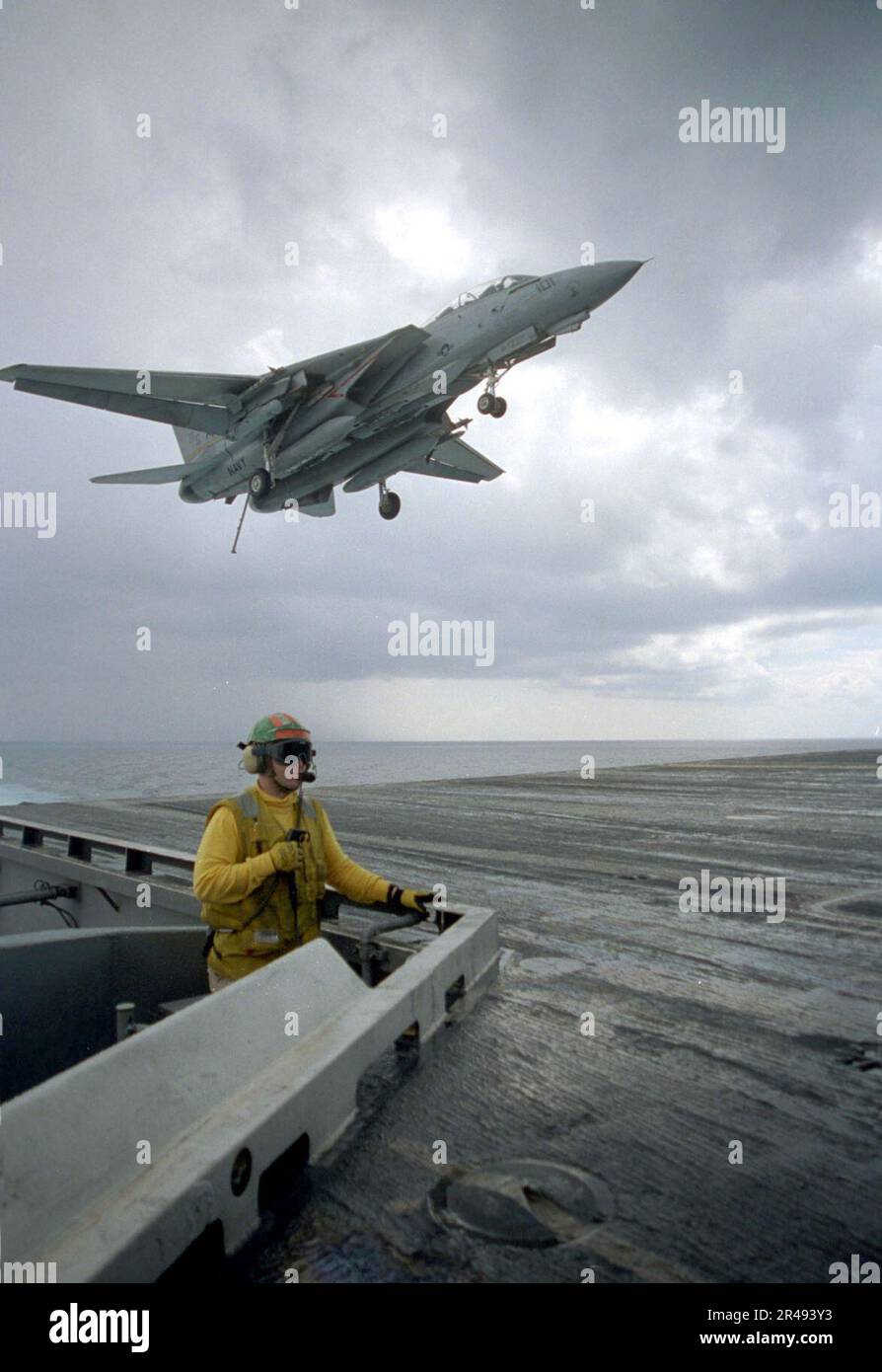 US Navy A flight deck safety observer watches over flight operations ...