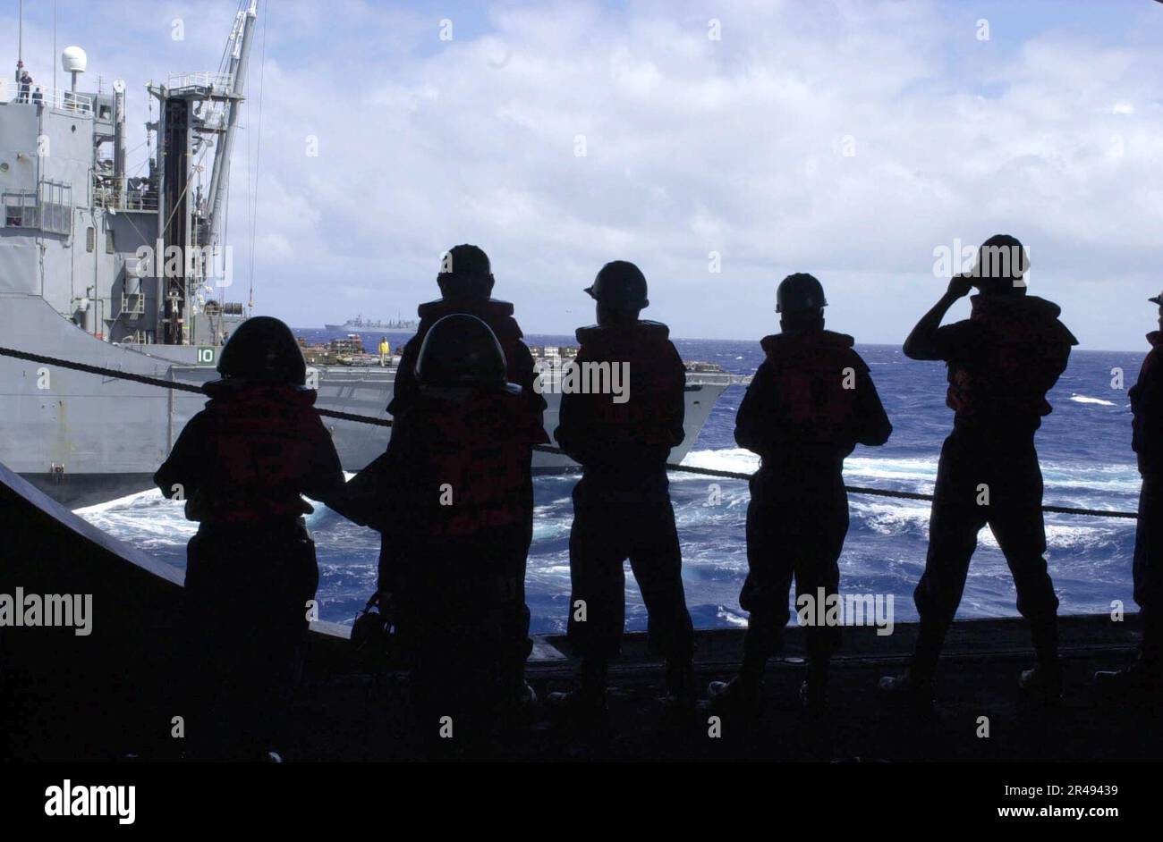 US Navy Deck Department personnel wait for the Military Sealift Command ...