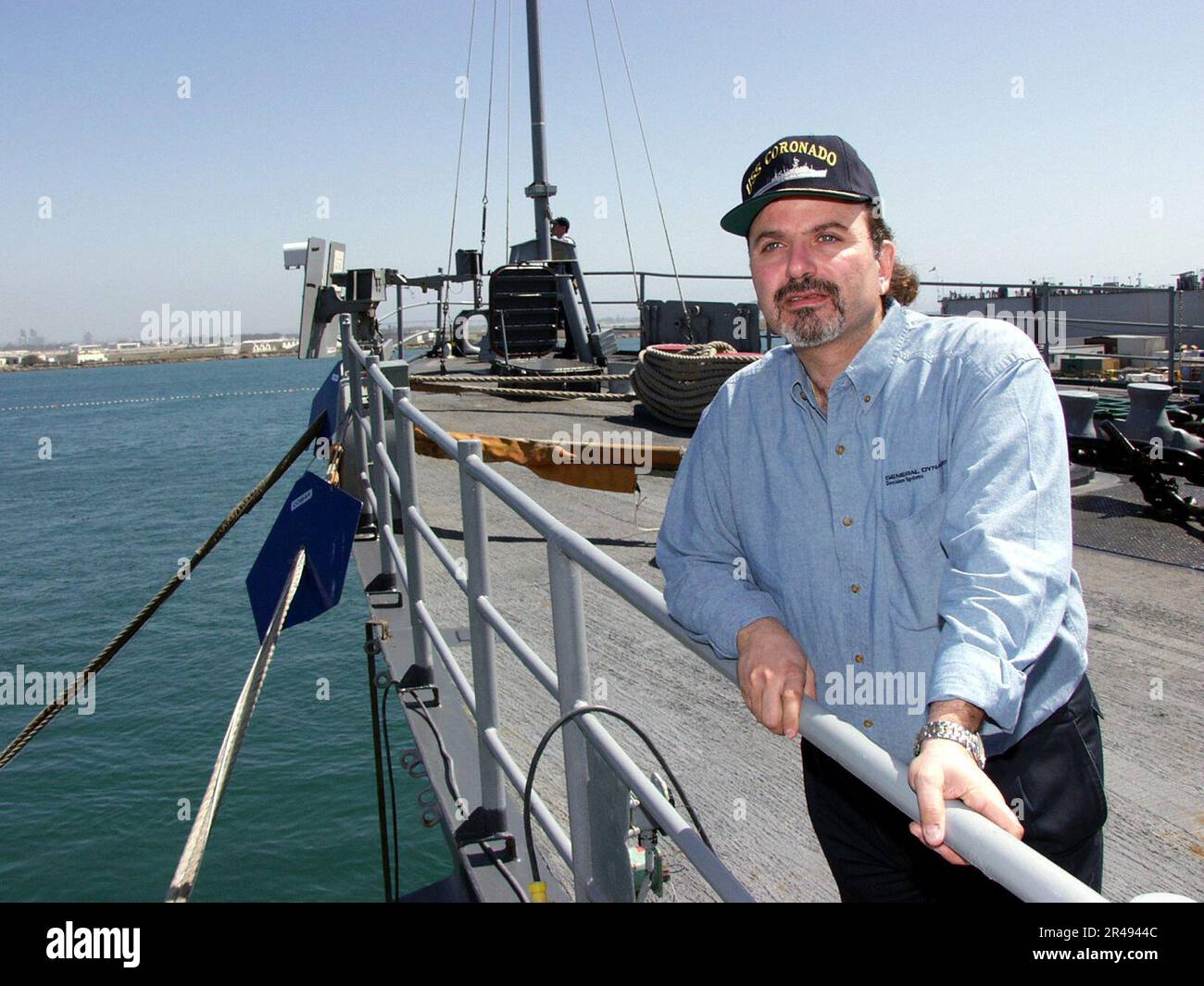US Navy Sam Khoury stands on the forecastle aboard Coronado, 26 years ...
