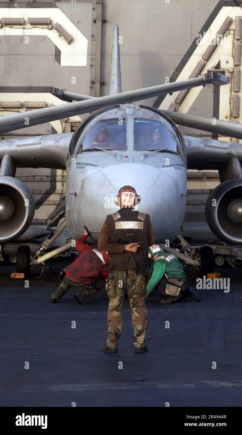 US Navy Aircraft maintenance crew members prepare an S-3 Viking ...